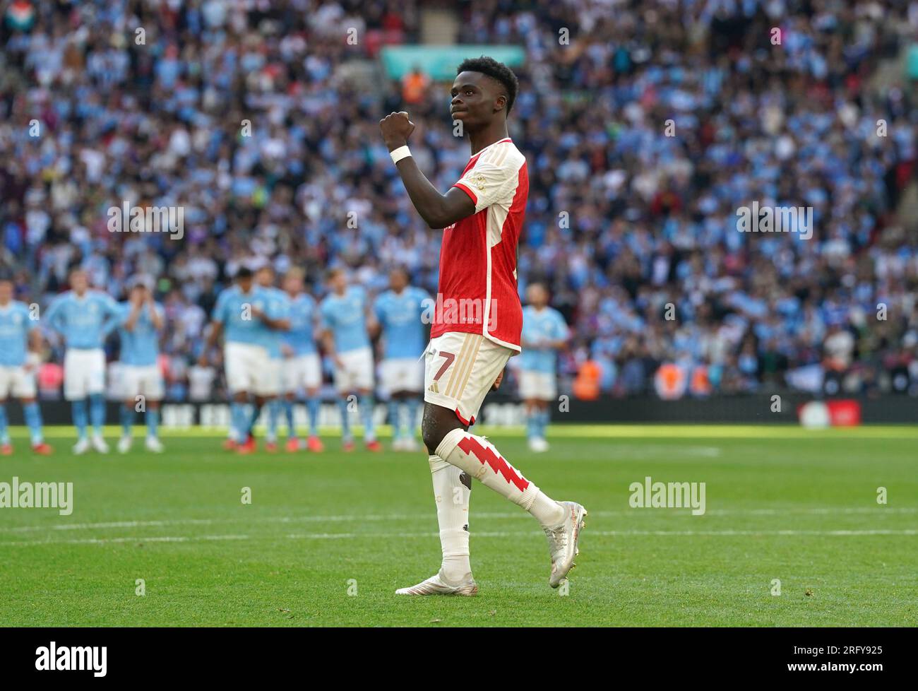 Arsenal's Bukayo Saka celebrates scoring from the penalty spot during ...