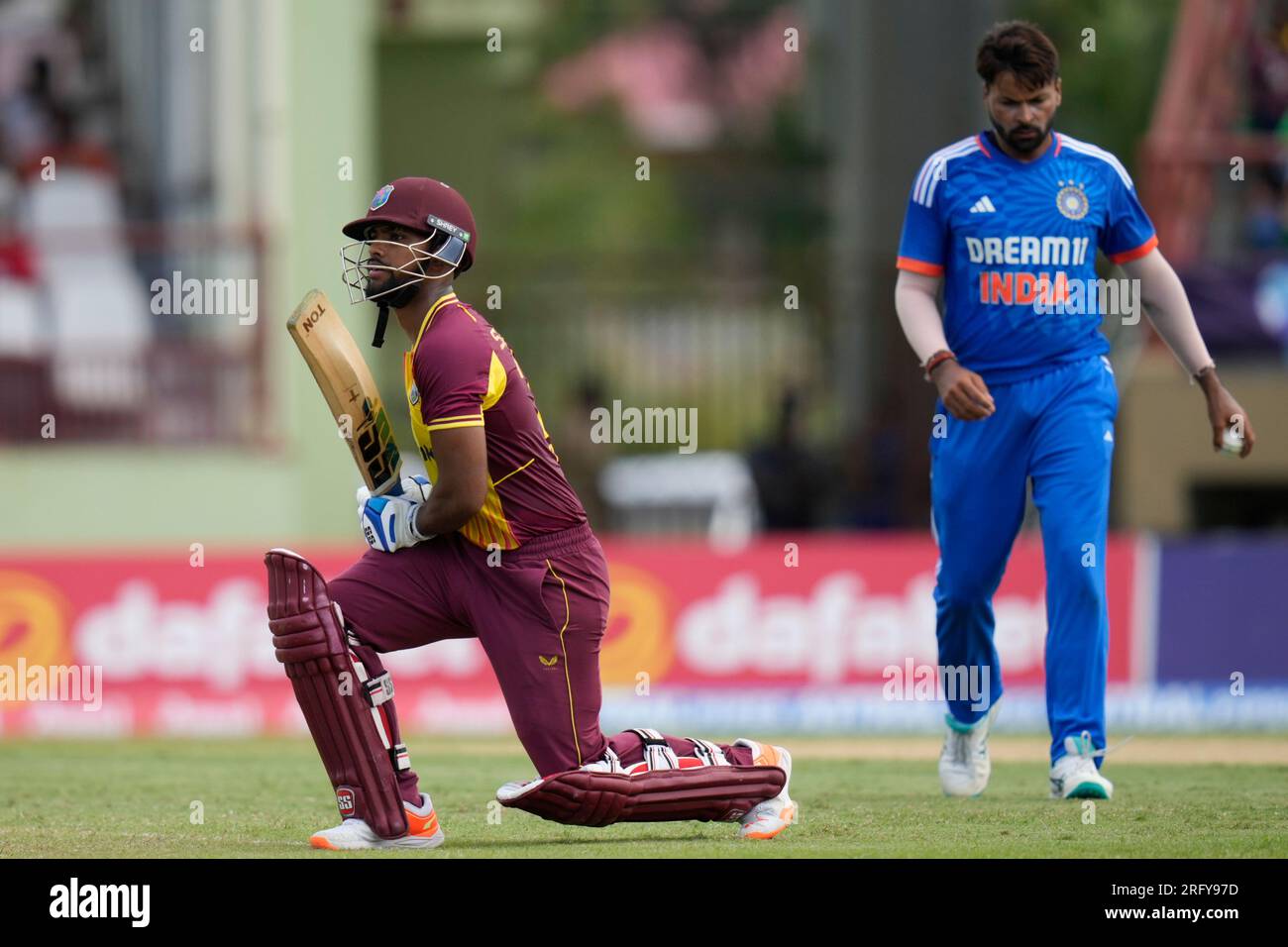West Indies' Nicholas Pooran as India's Mukesh Kumar prepares to bowl ...