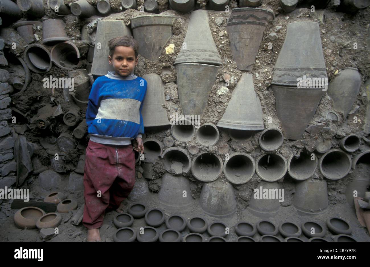 a child in a Pottery Factory in the Old Town of Cairo the Capital of ...