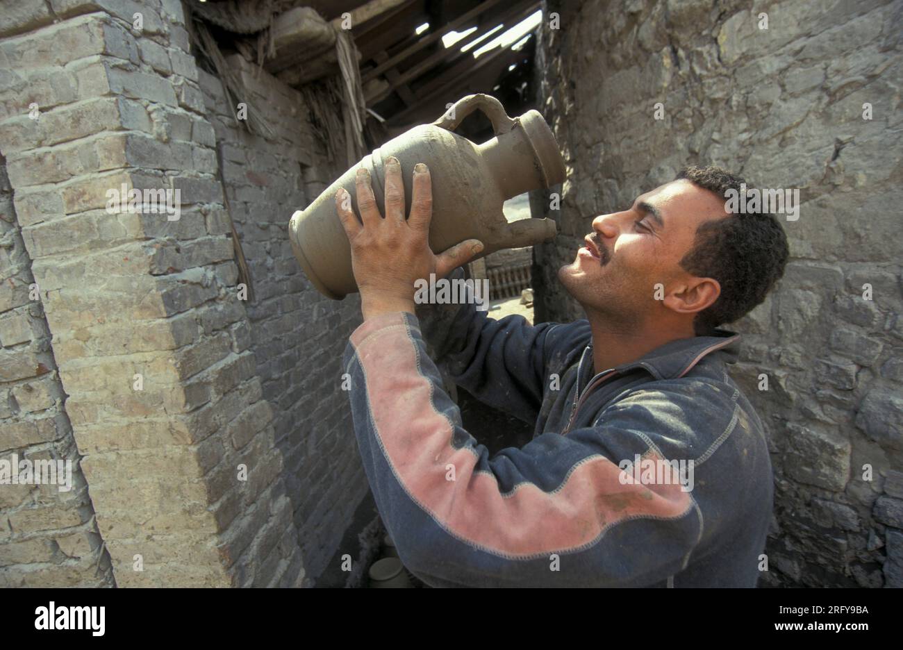 Men workers in a Pottery Factory in the Old Town of Cairo the Capital ...