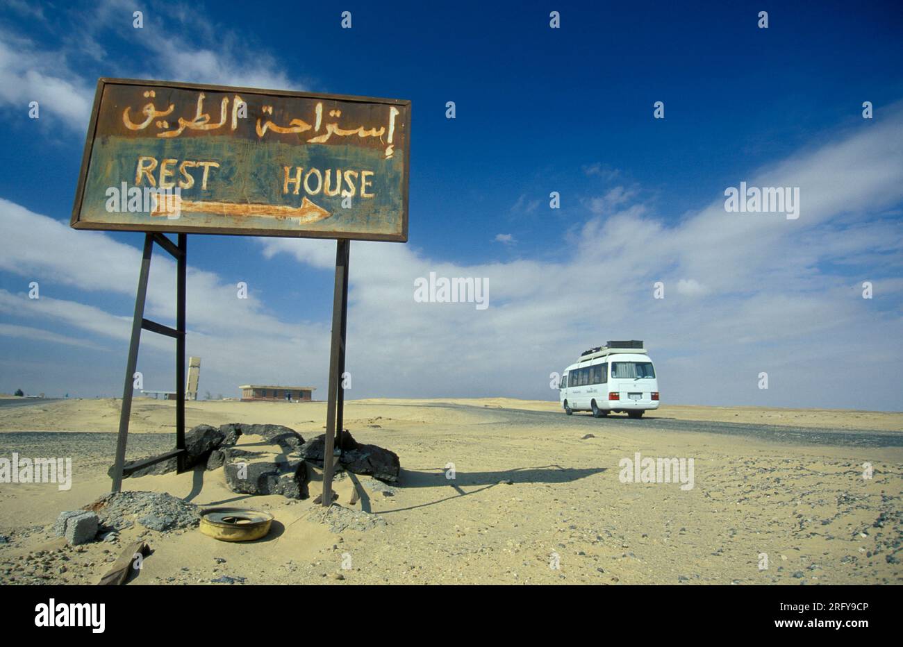 a sign of a rest house at the Desert road between the Town and Oasis of ...