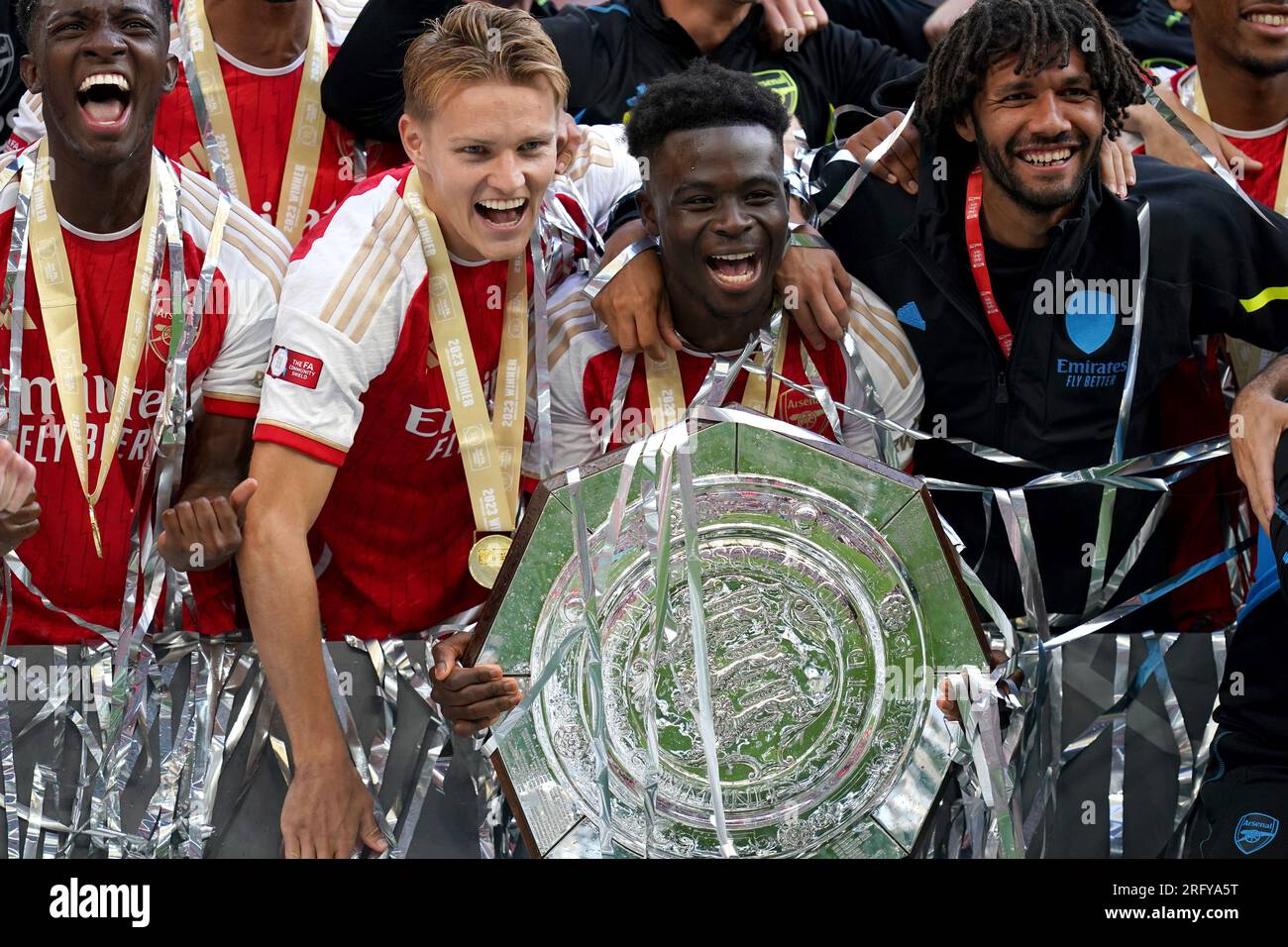 Arsenal's Martin Odegaard (centre left) and Bukayo Saka celebrates with ...