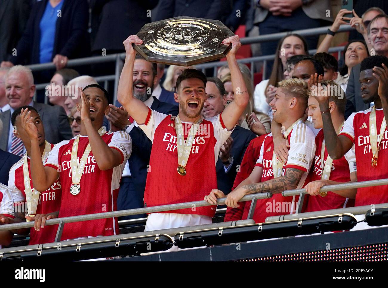 Arsenal's Declan Rice (centre) and team-mates lift the trophy after the ...