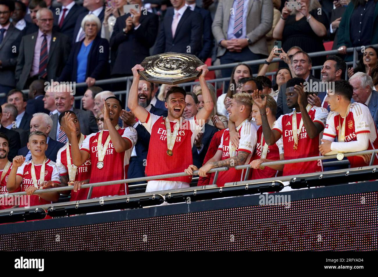 Arsenal's Declan Rice (centre) and team-mates lift the trophy after the ...