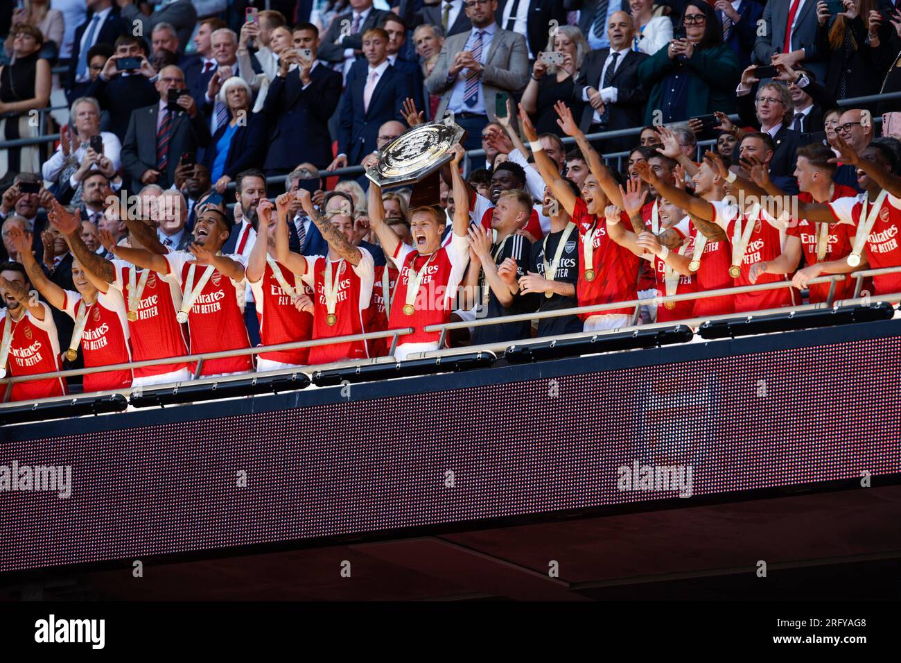 Arsenal's Martin Odegaard lifts the trophy after winning the English FA ...