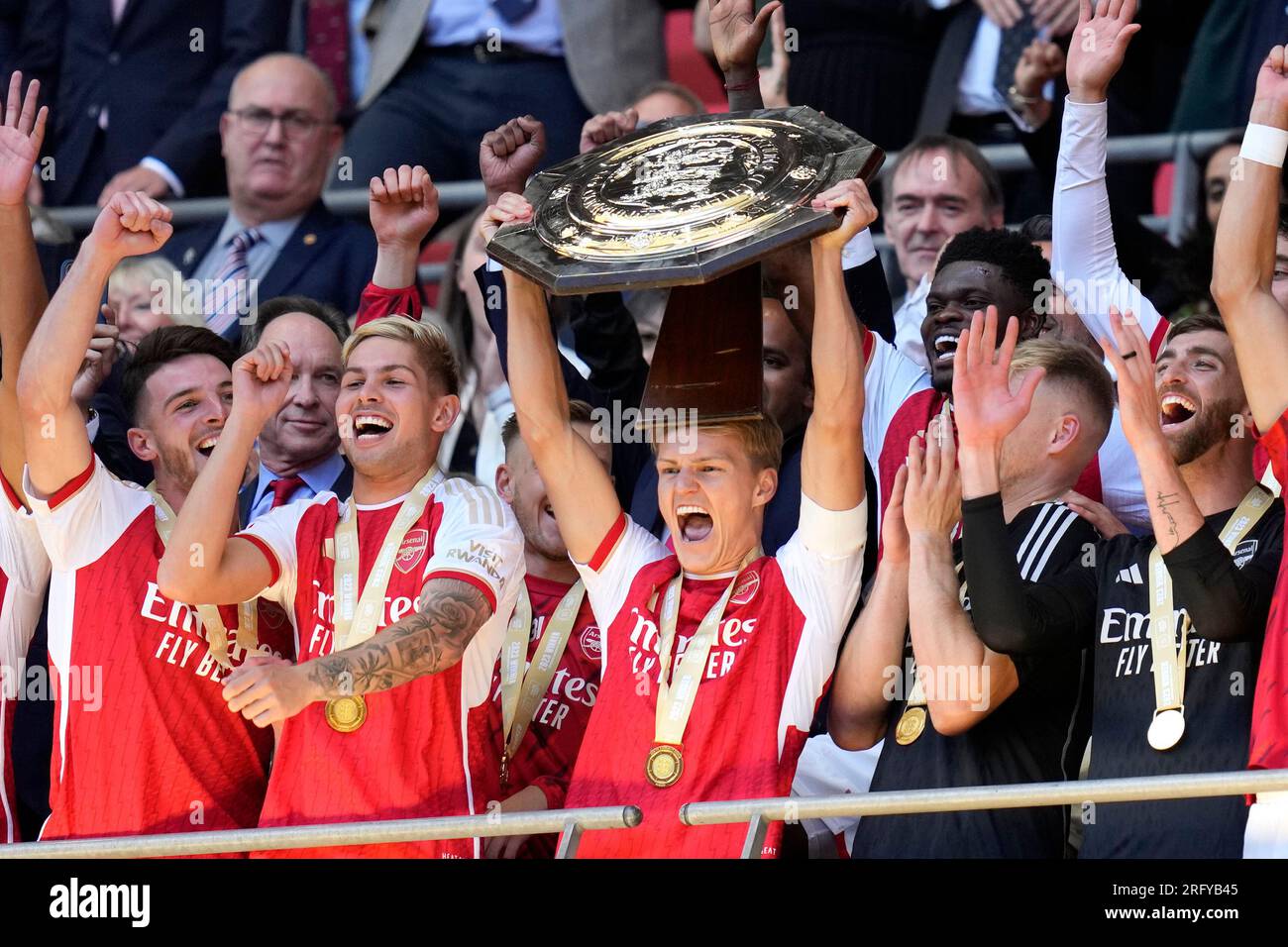 Arsenal's Martin Odegaard holds up the trophy after winning the English ...