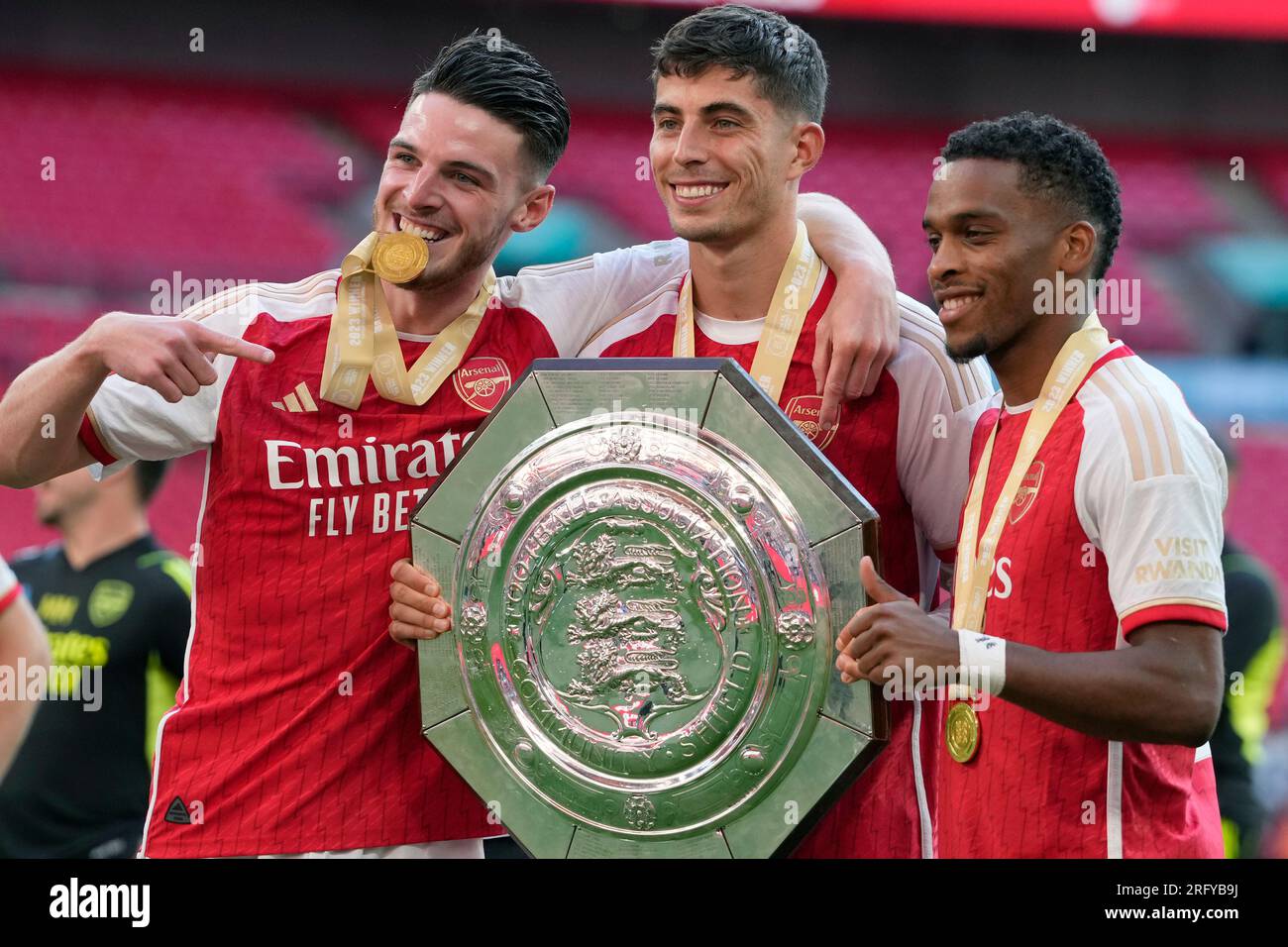 Arsenal's Declan Rice, left, Arsenal's Kai Havertz, centre, Arsenal's Jurrien Timber hold the ...