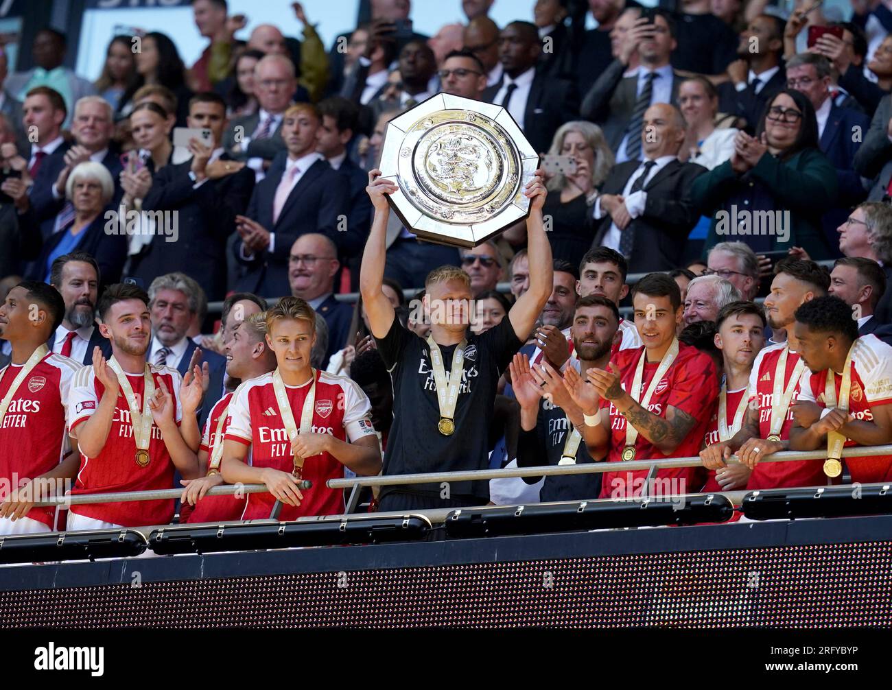Arsenal goalkeeper Aaron Ramsdale (centre) and team-mates lift the ...
