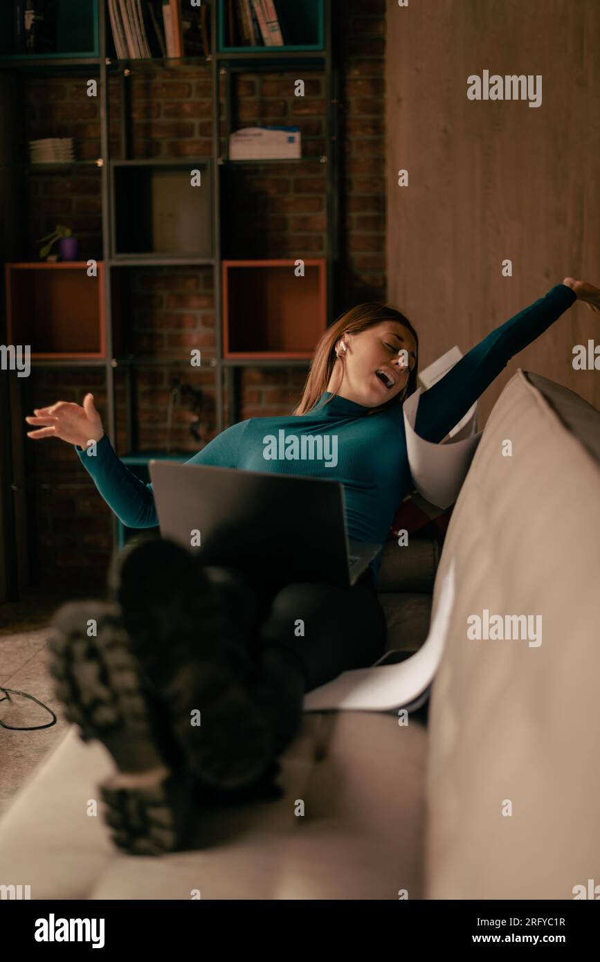 Excited girl waving her hands up and feeling relieved after she ...