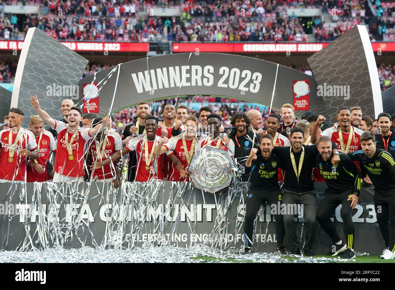 Arsenal players and staff celebrates with the trophy after the FA ...