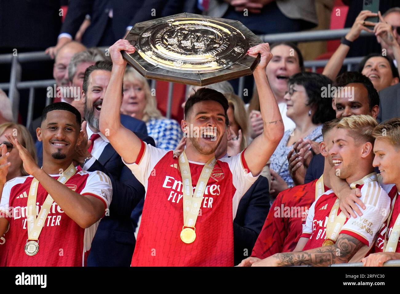 Arsenal's Declan Rice holds up the trophy after winning the English FA ...