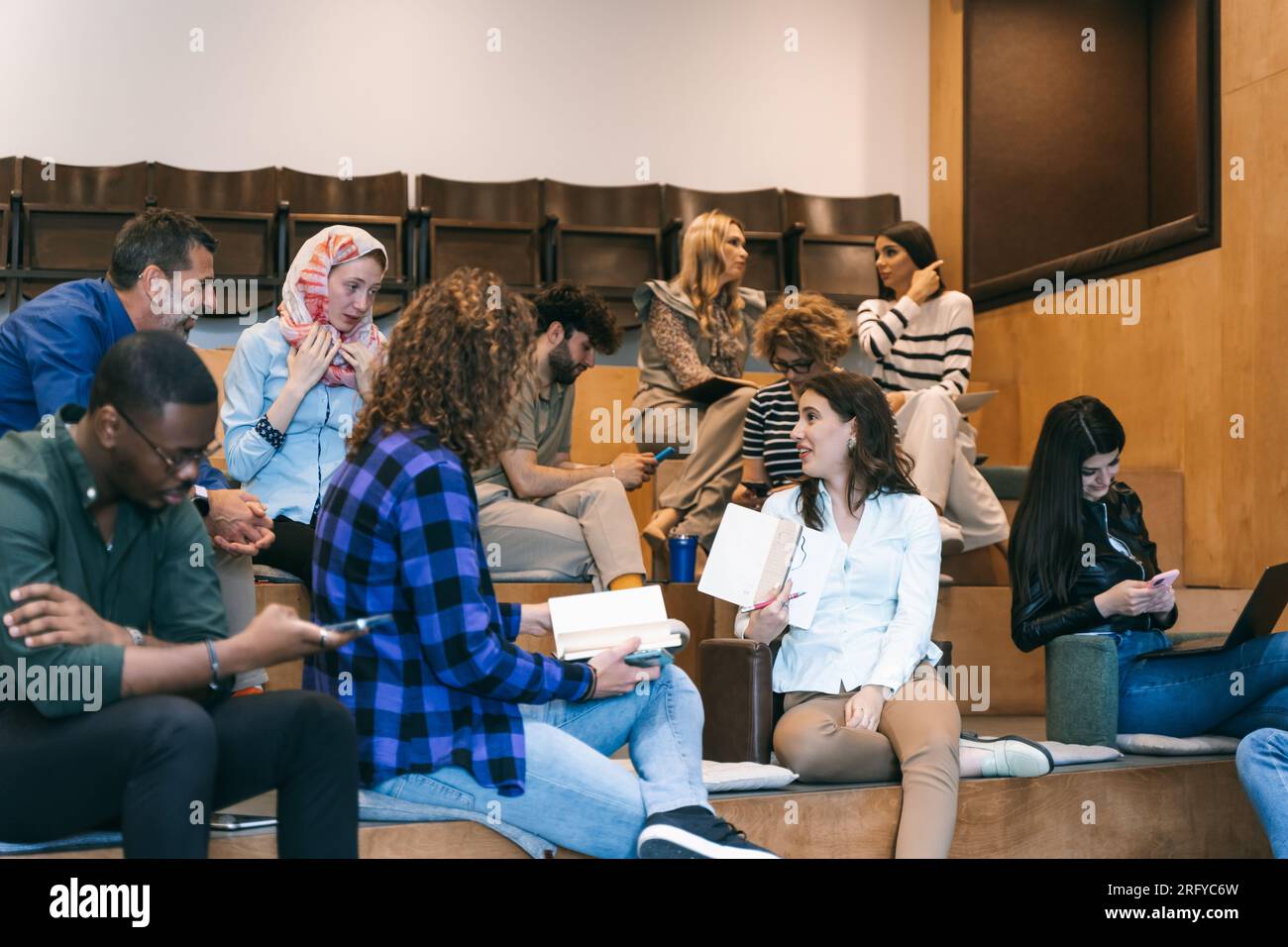 Diverse group of creative people having fun at work while taking a ...