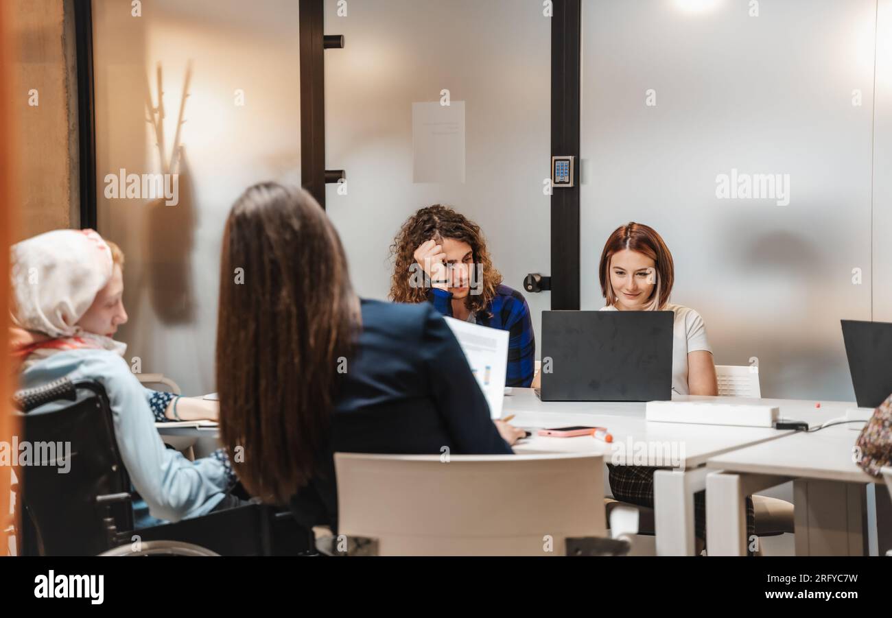 Beautiful girl, programmer employee, writing a new code. Experienced ...