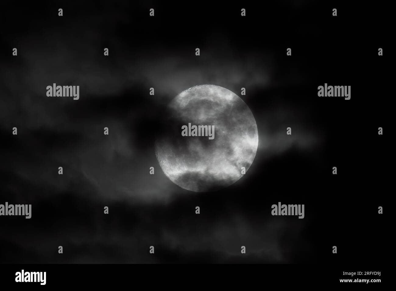 Halloween full moon in pitch black dark skies with clouds Stock Photo ...