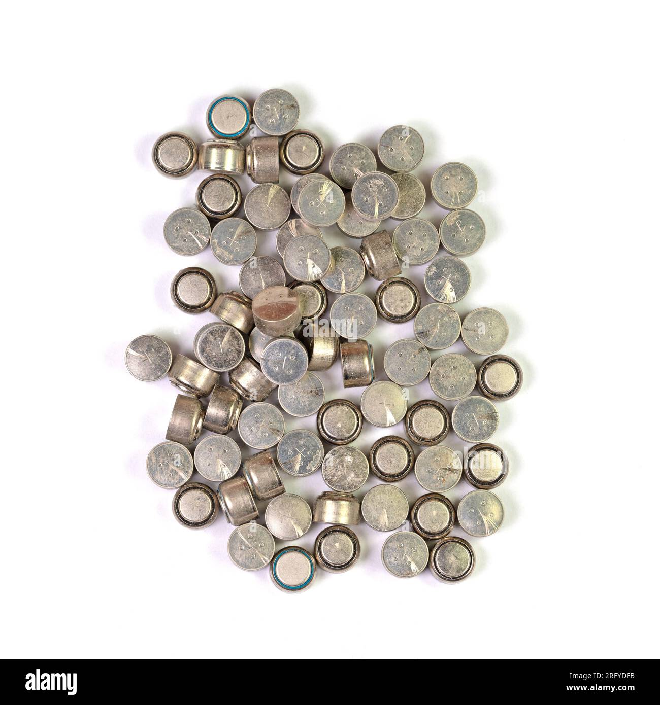 Many old button cells against a white background Stock Photo - Alamy