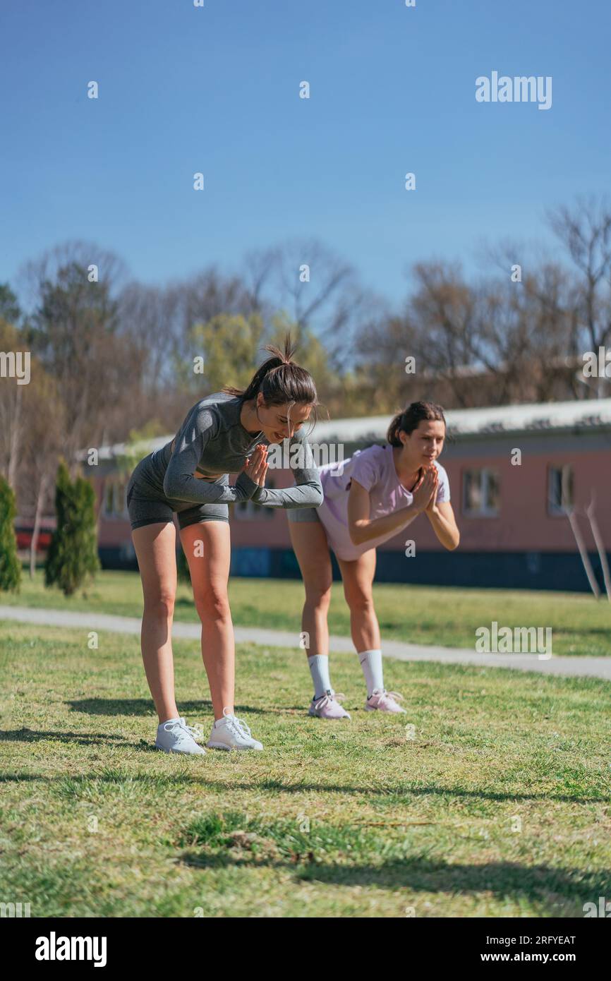 Sportsgirls saluting before training Stock Photo - Alamy