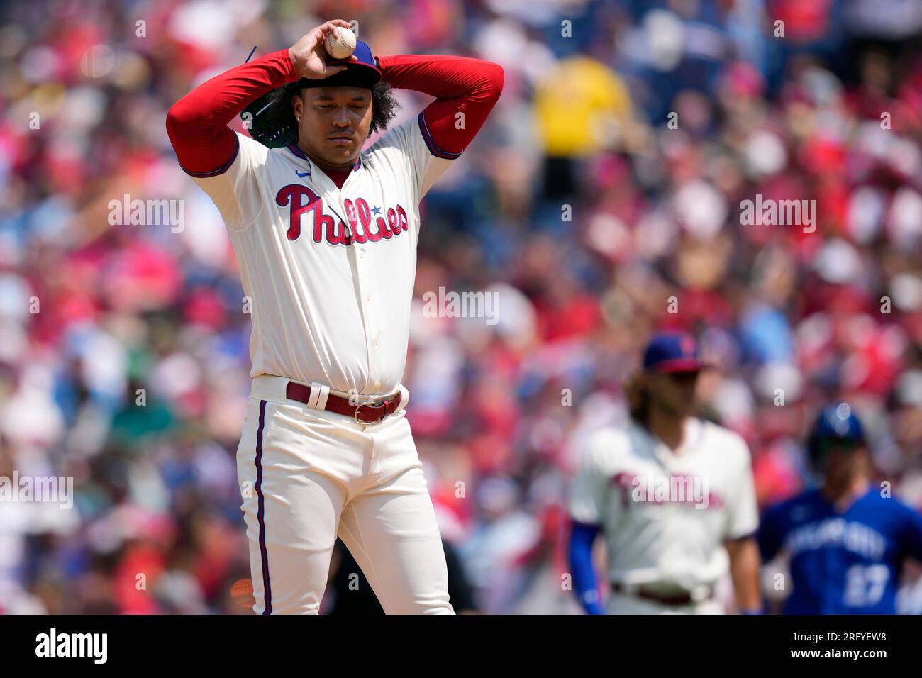 Philadelphia Phillies pitcher Taijuan Walker adjusts his hat after giving up an RBI-sacrifice ...