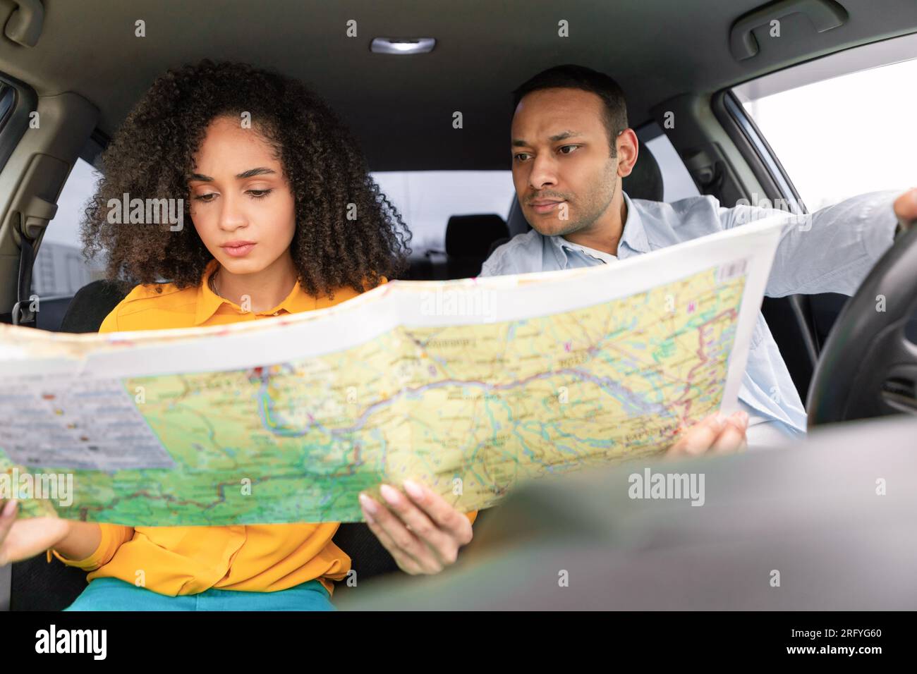 Confused woman car travel road map hi-res stock photography and images ...