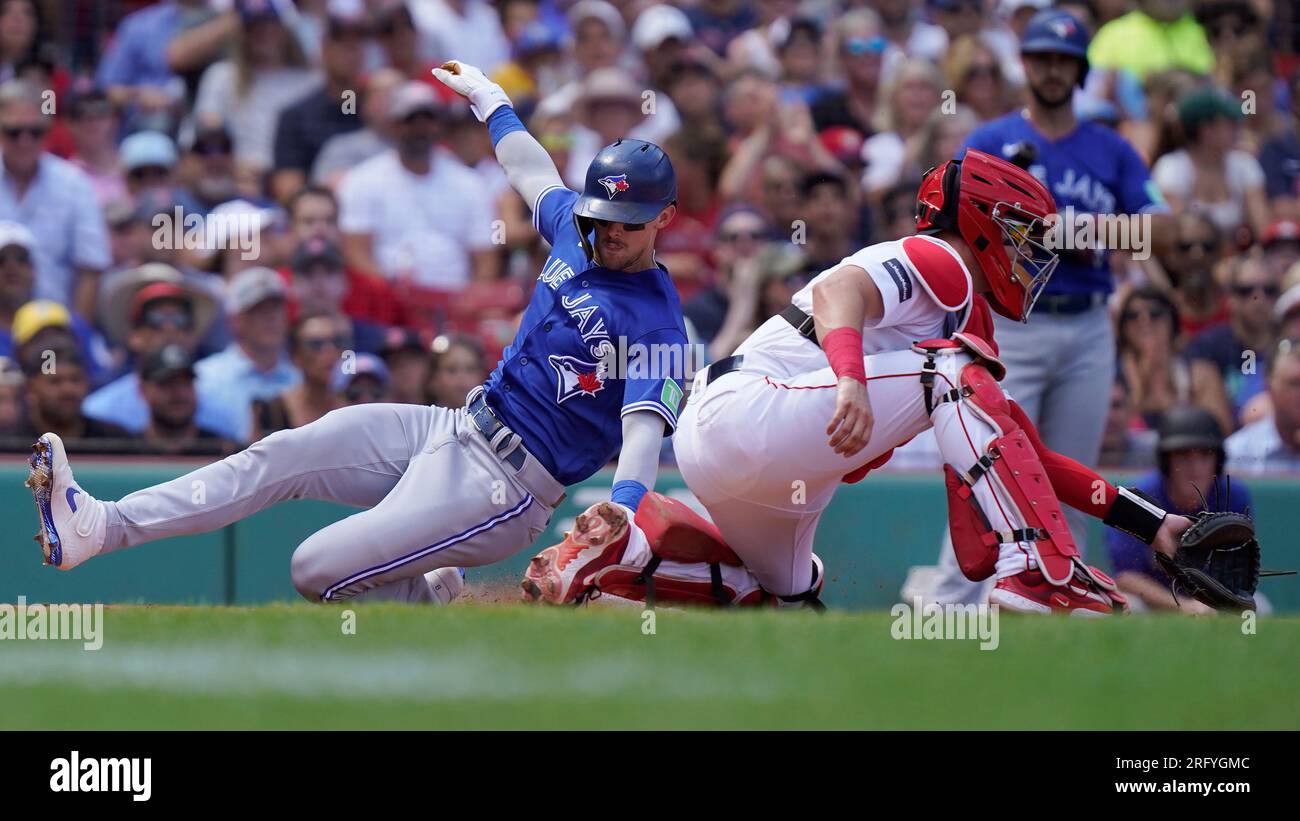 Toronto Blue Jays' Cavan Biggio, left, scores on a single by Kevin ...