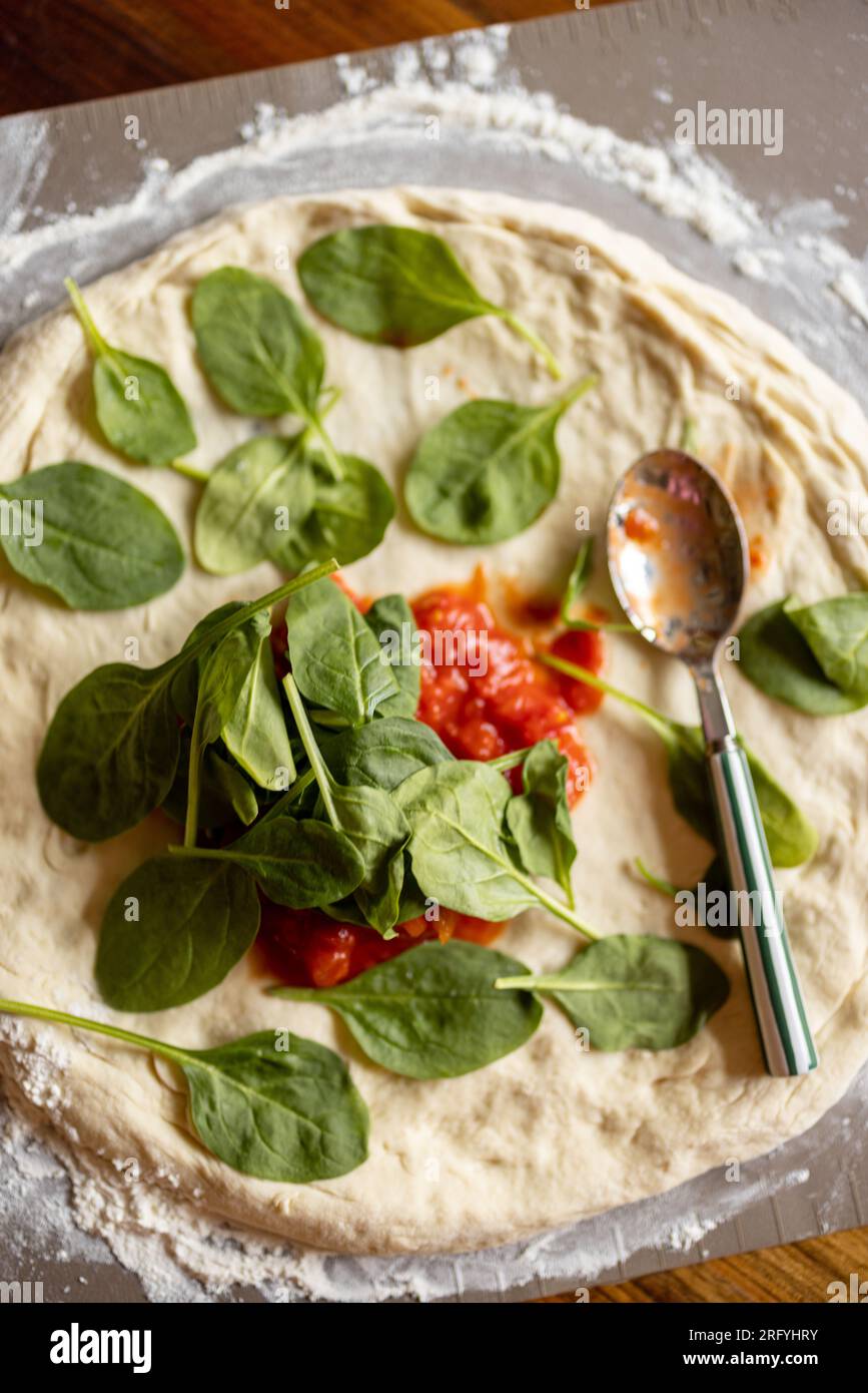 Cooking homemade pizza Stock Photo - Alamy
