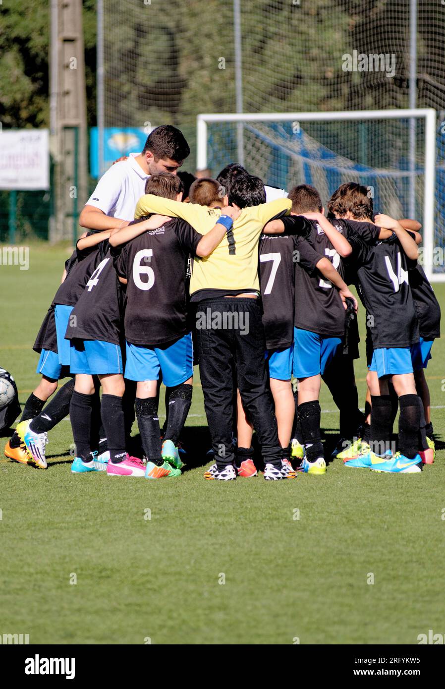 Trainer gave direction to young kids children teenage boys - playing ...