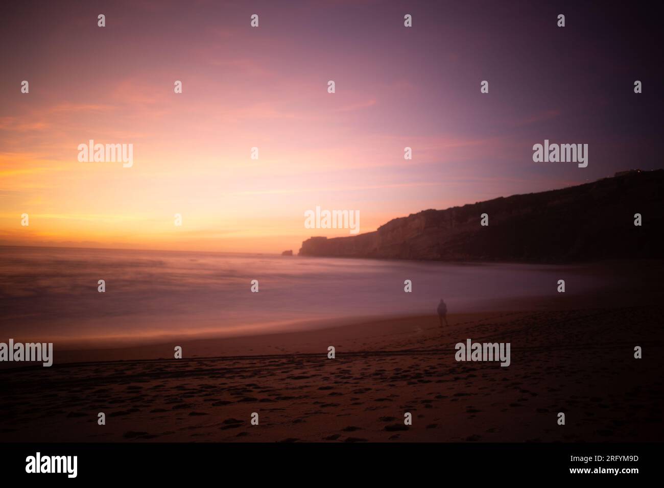 Nazaré's mesmerizing promontory: Sunset's golden embrace paints the ...