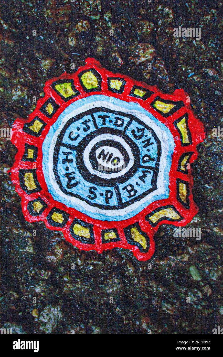 London, UK. Tiny work of art painted on a discarded piece of chewing ...