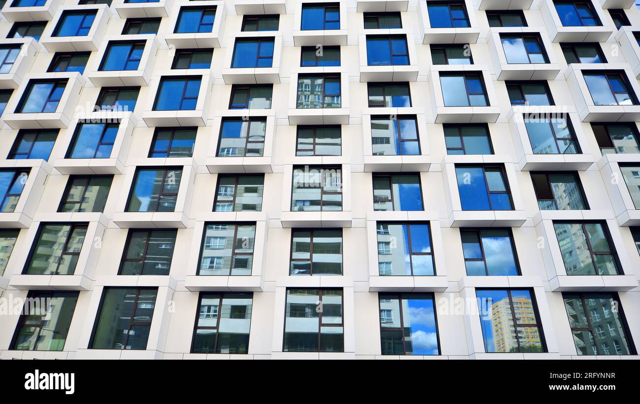 The facade of the new apartment building shaped like cubes. Minimalist ...