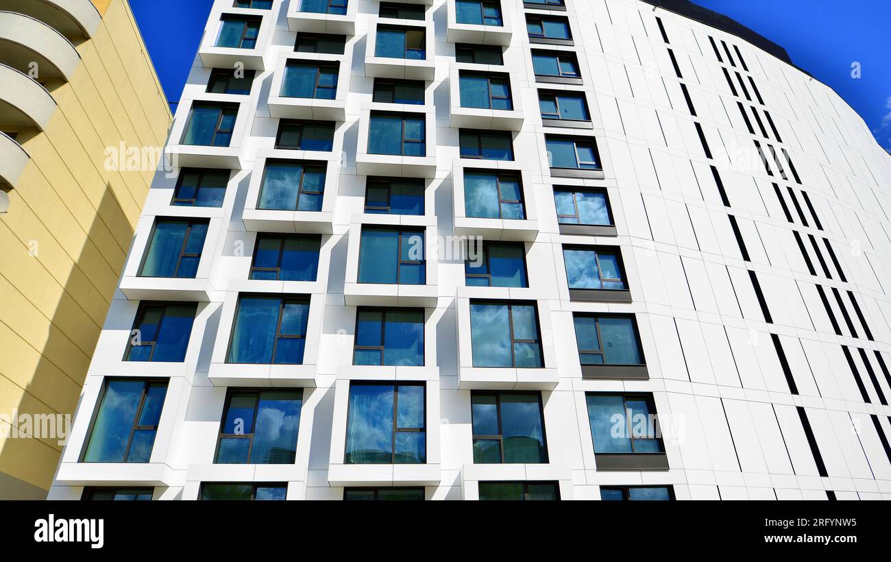 The facade of the new apartment building shaped like cubes. Minimalist ...