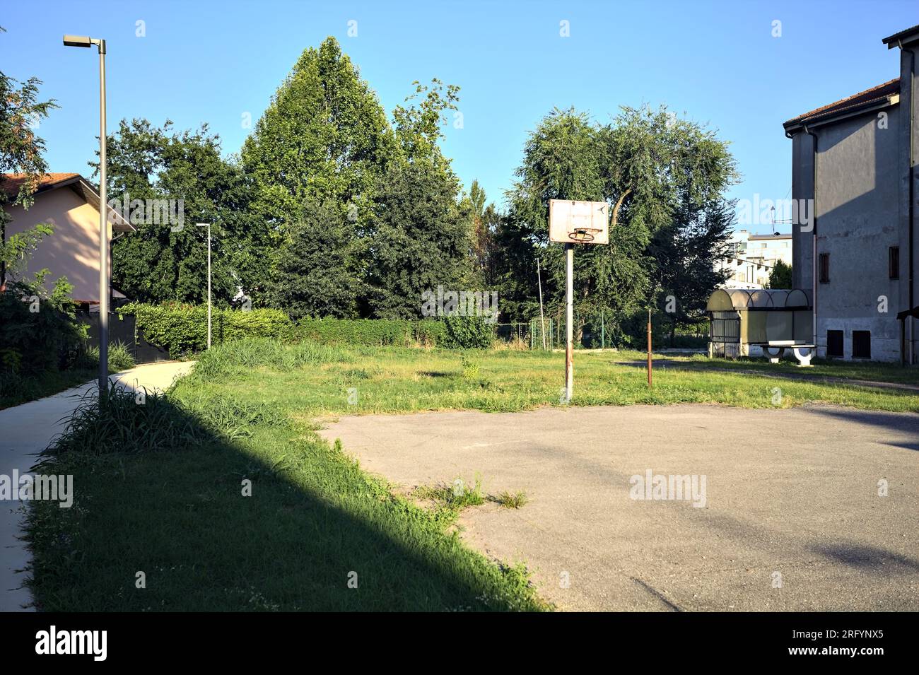 Basketball court on the side of a church at sunset in the italian ...