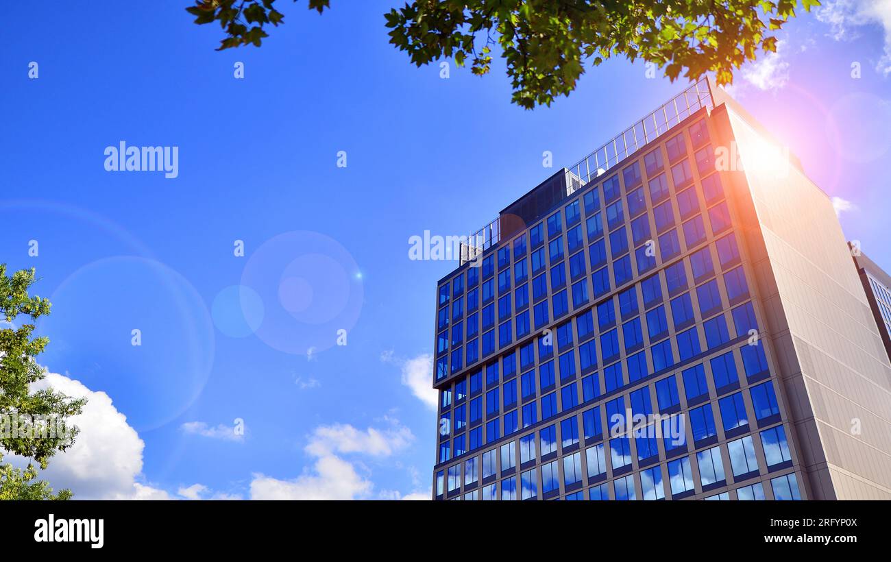 Eco building in modern city concept. Fresh green trees and office ...