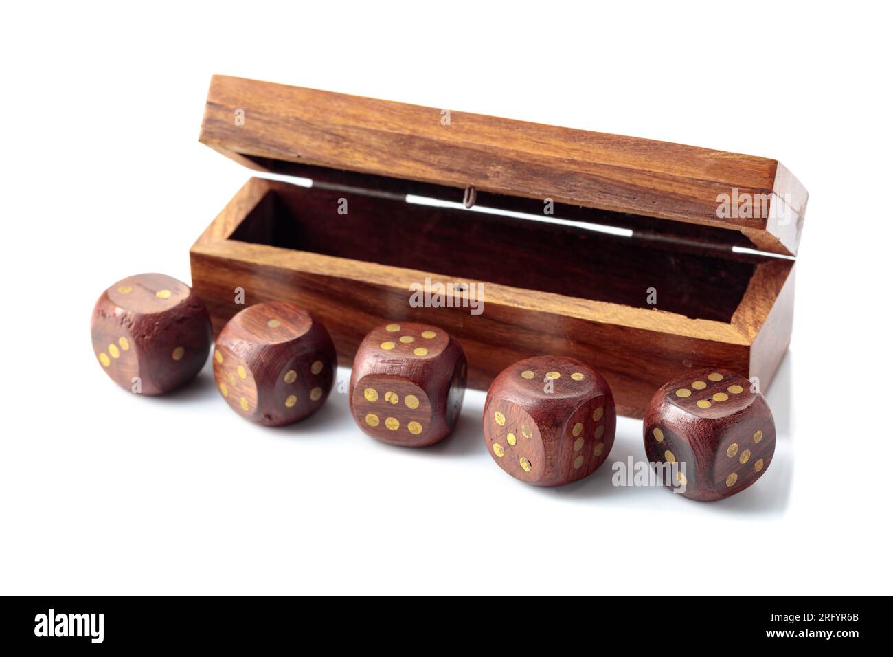 The old wooden dice with the box is isolated on a white background ...