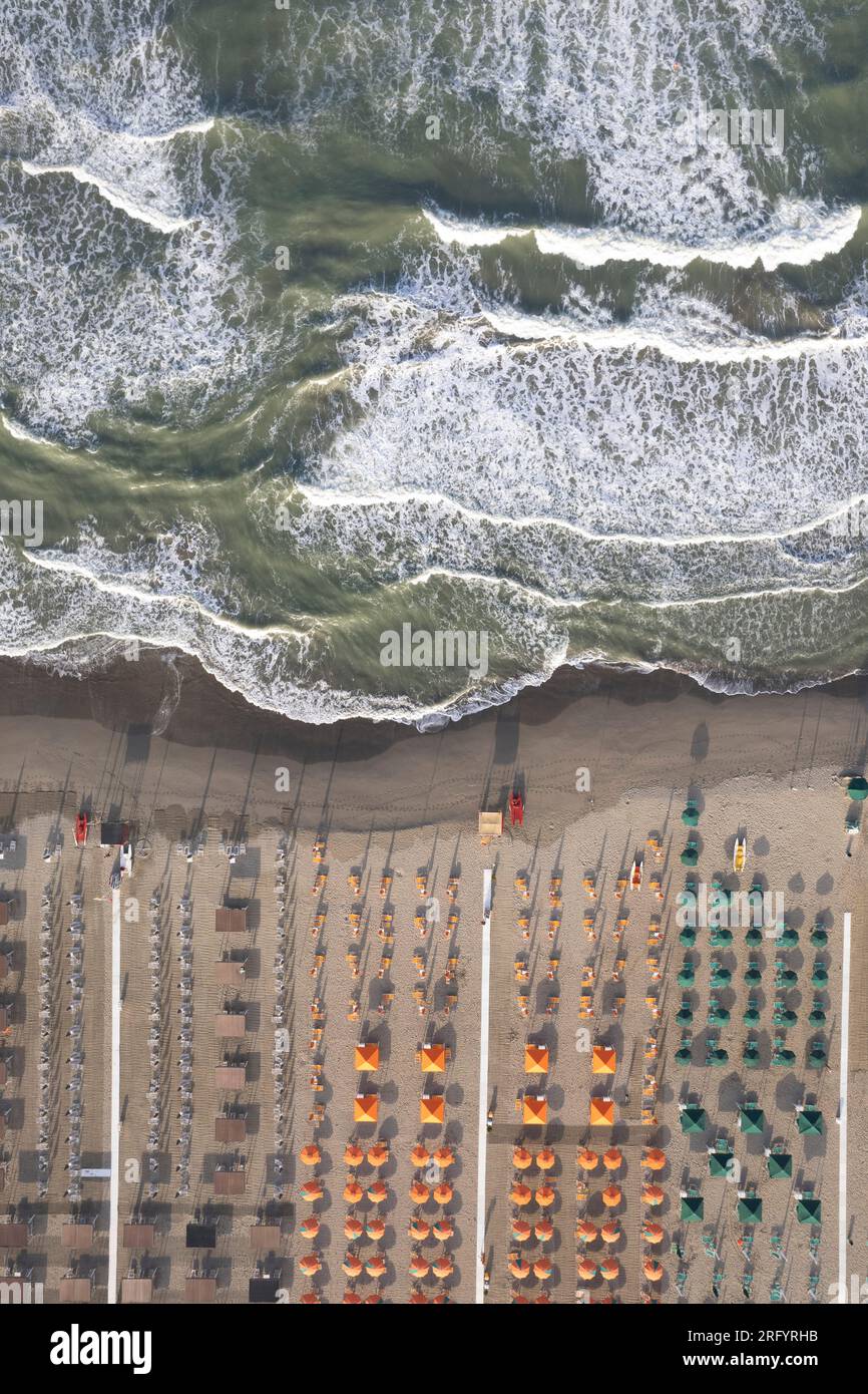 Aerial view of Versilia beach with rough sea photographed from above ...