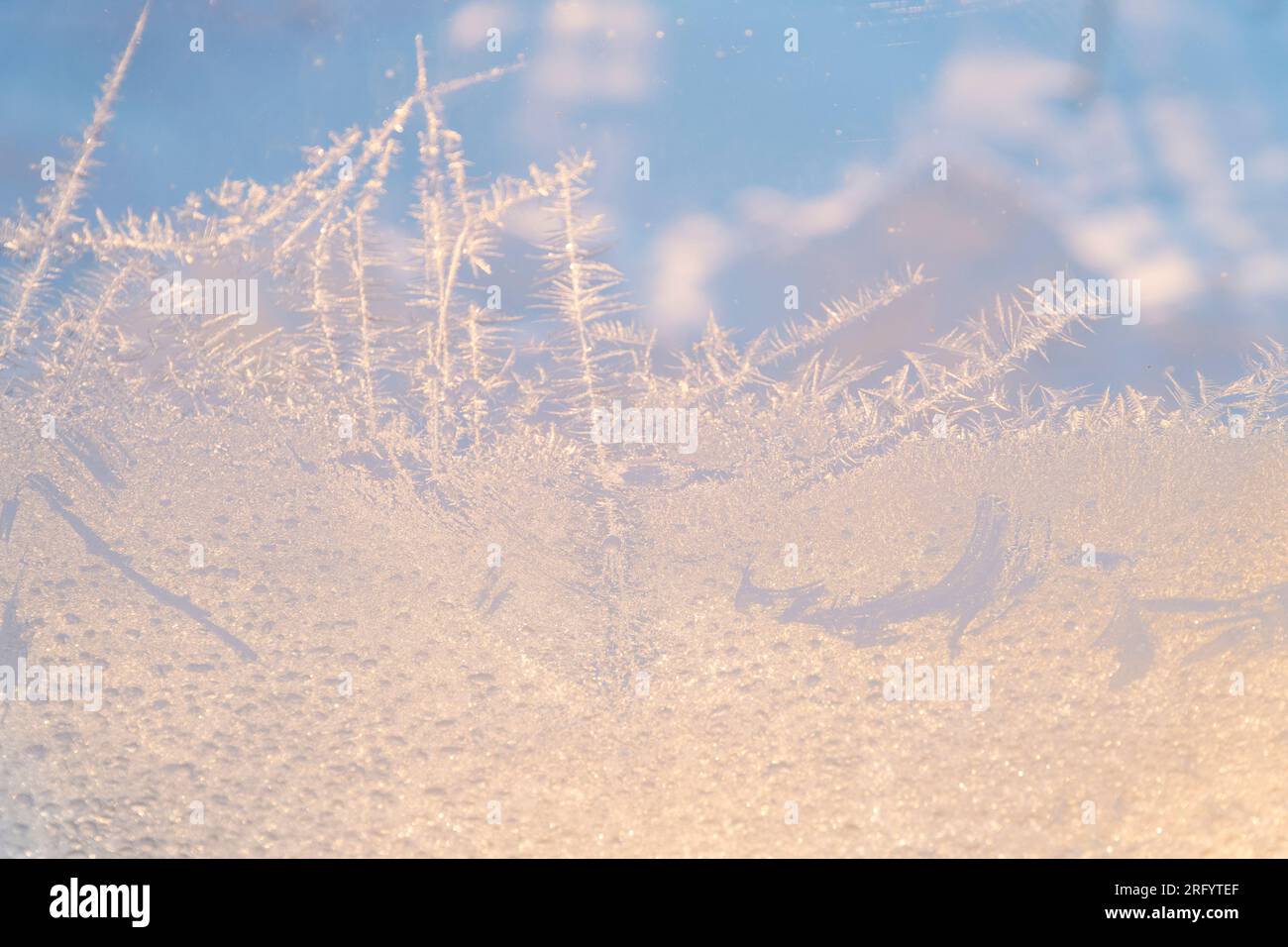 Fire and Ice, Sun shining through ice covered window in Winter Stock ...