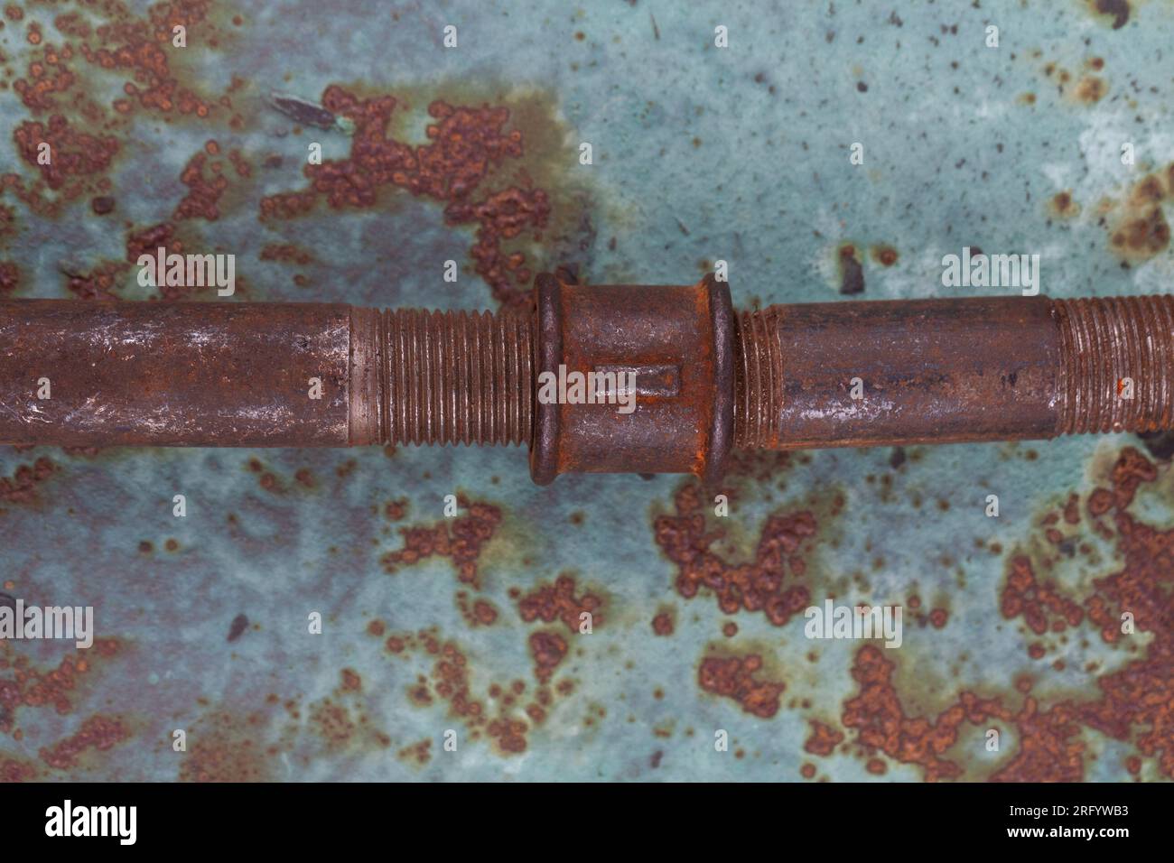 Rusty valve pipes on rusty metal wall background Stock Photo - Alamy