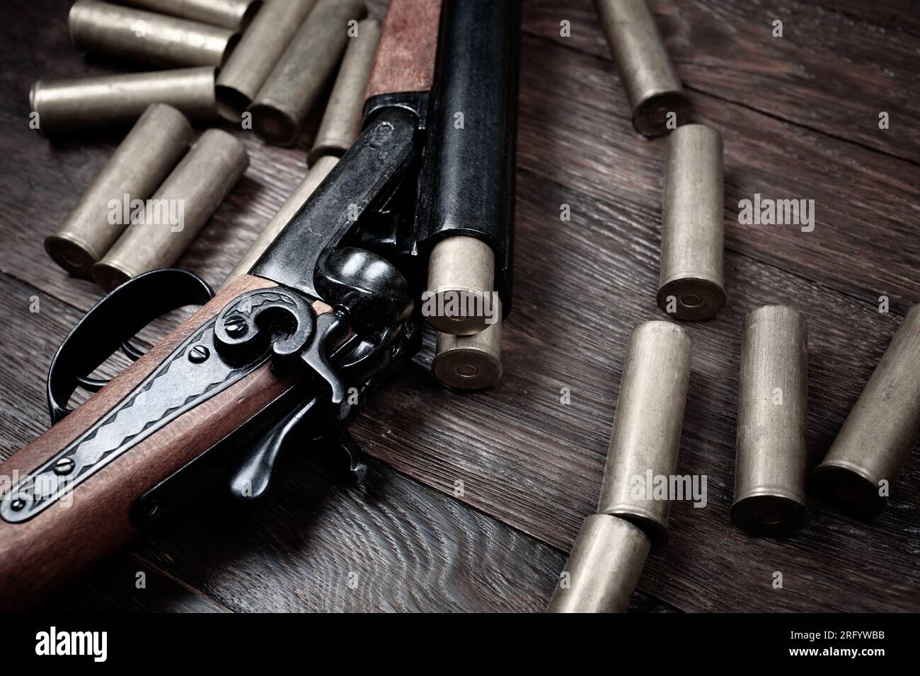 Vintage retro double-barreled hunting shotgun with brass cartridges on ...