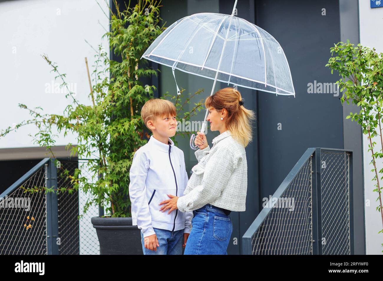 mother accompanies the child to school. mom to accompany him to school ...