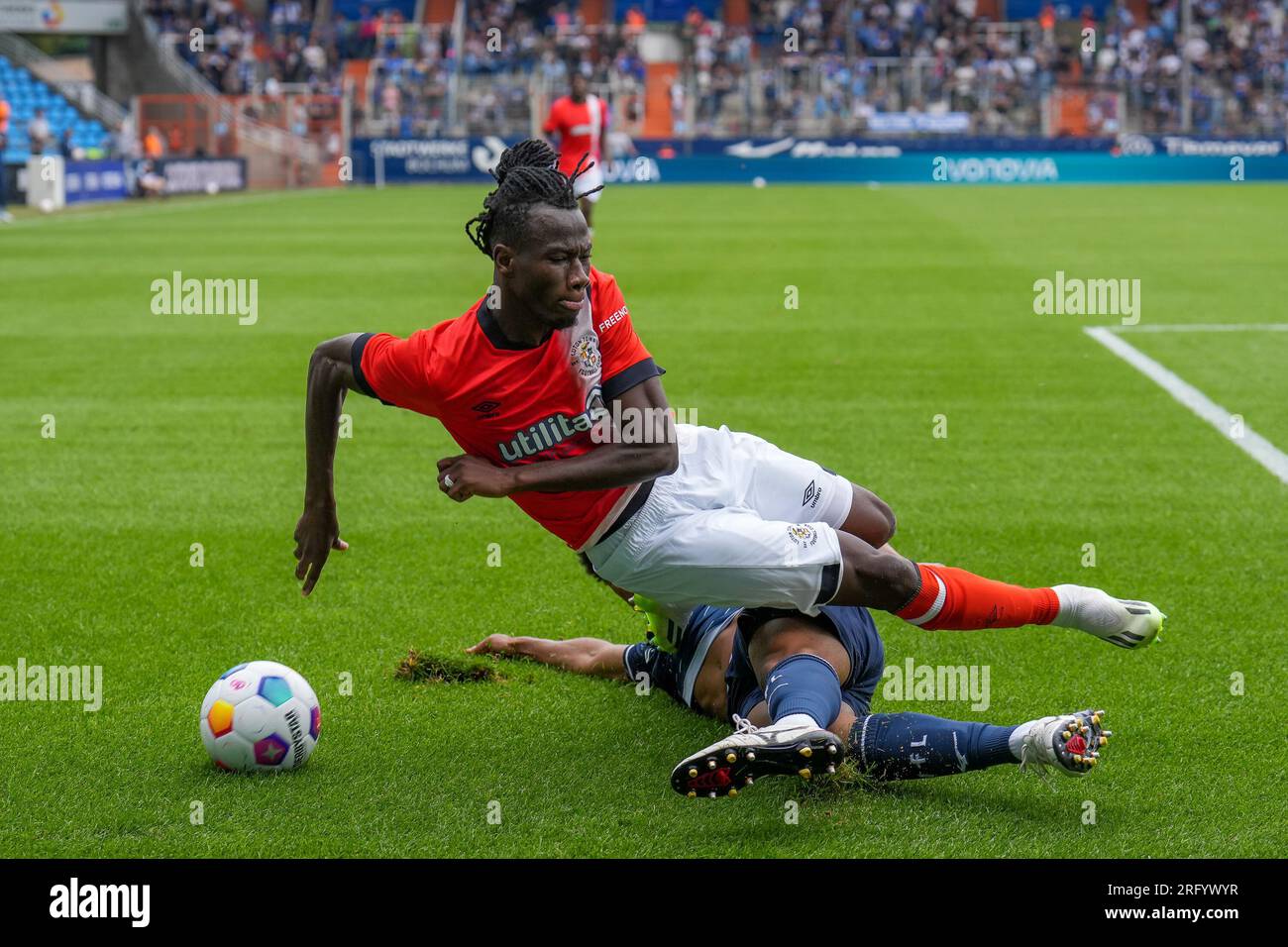 Bochum, Germany. 05th Aug, 2023. Issa Kabore of Luton Town is tackled ...