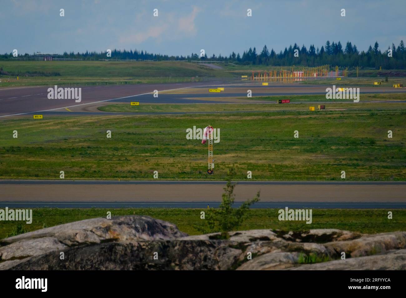 Helsinki / Finland - AUGUST 5, 2023: An airport tarmac with a windsock ...
