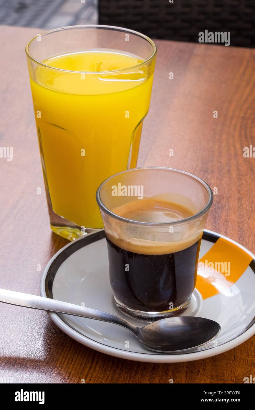 Glass of coffee and orange juice Stock Photo - Alamy