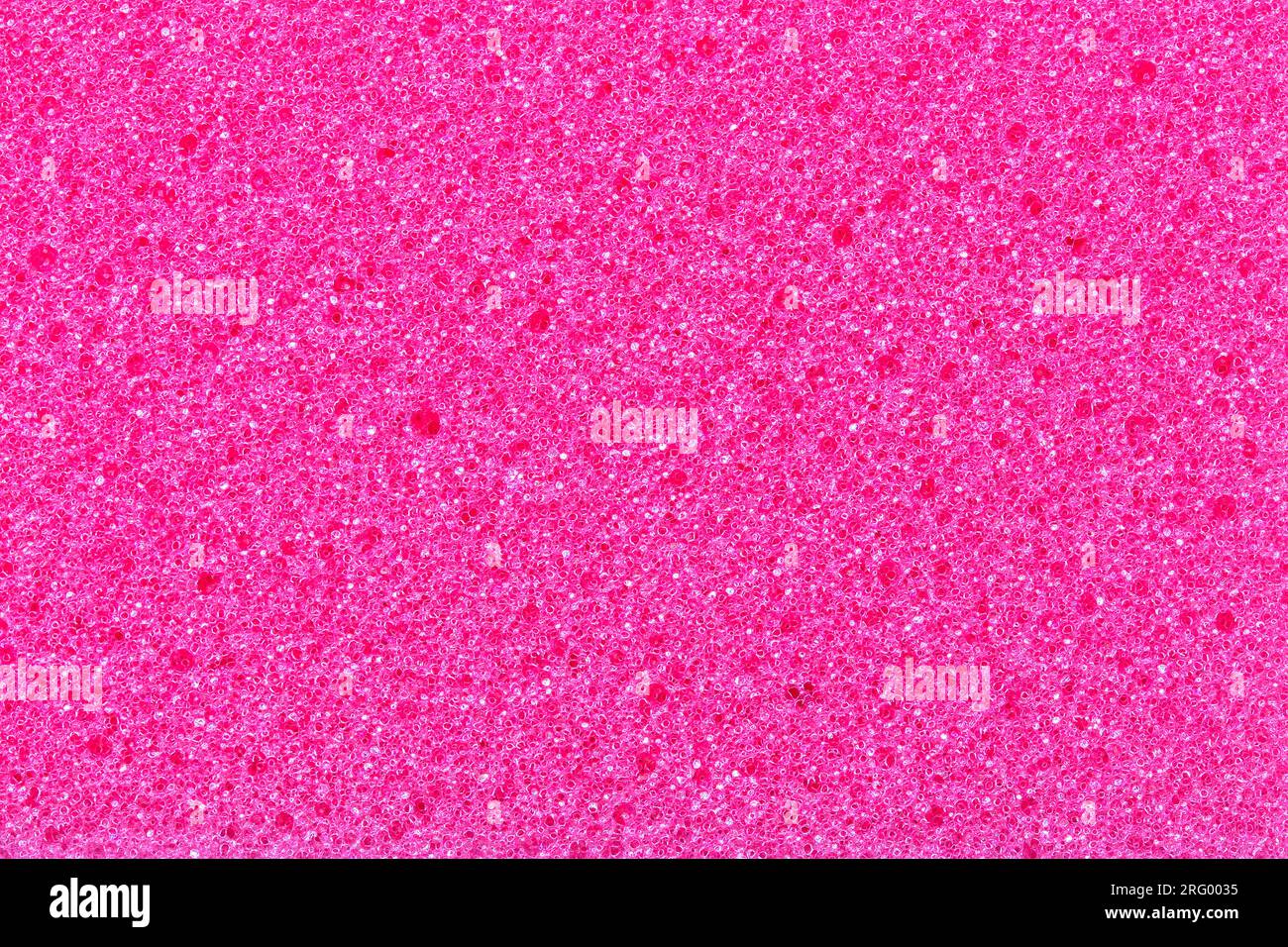 Close up on pink kitchen sponge textured background Stock Photo - Alamy