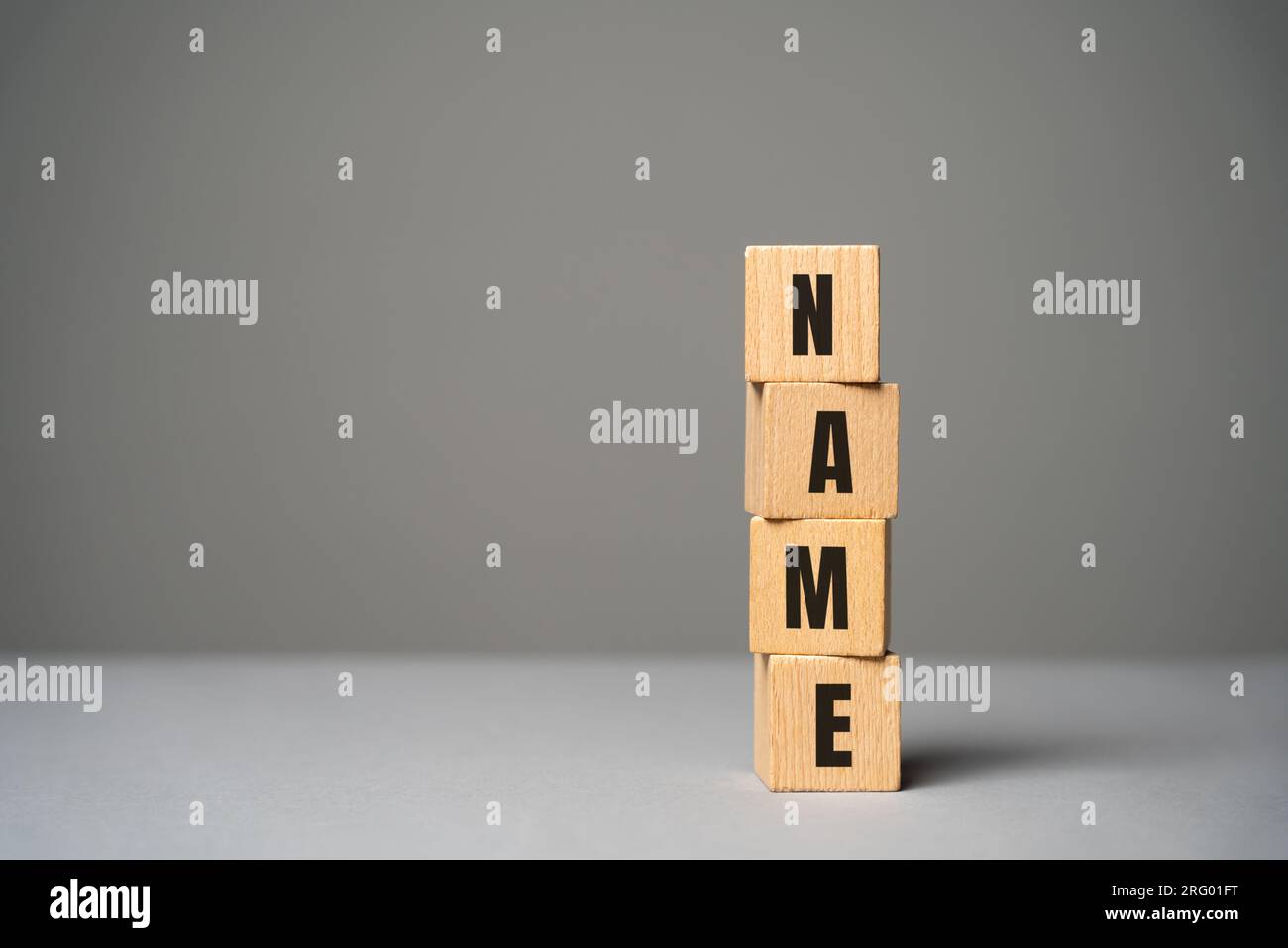 Name inscription on wooden blocks concept. Creation of a new personal ...