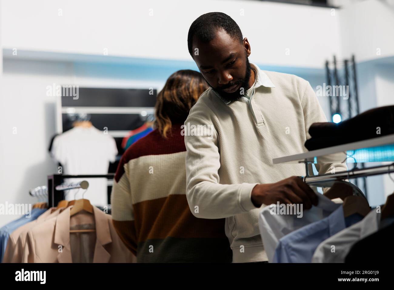 Shopper choosing formal wear outfit and searching for shirt size on ...