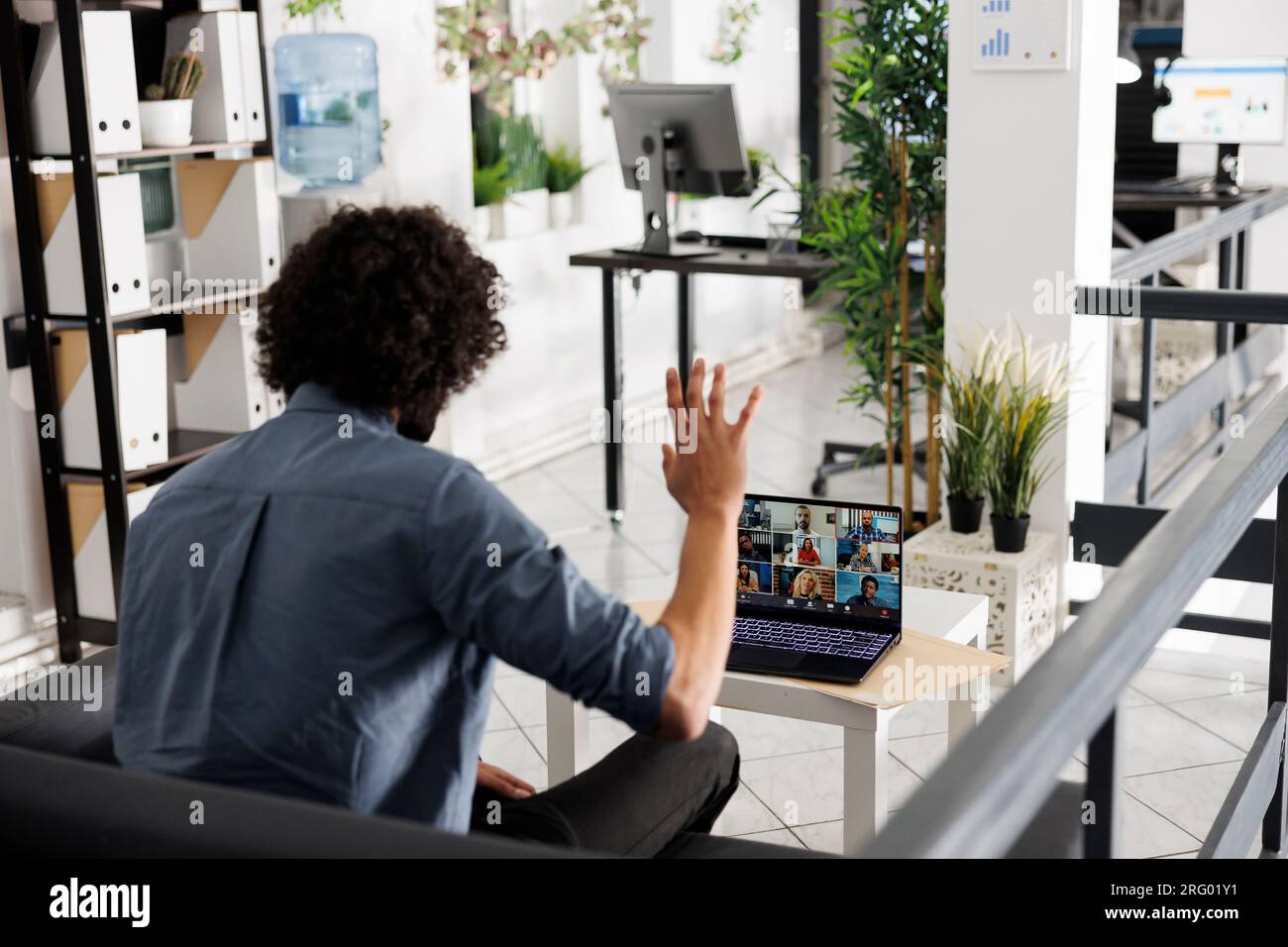 Project manager greeting group of diverse coworkers, collaborating ...
