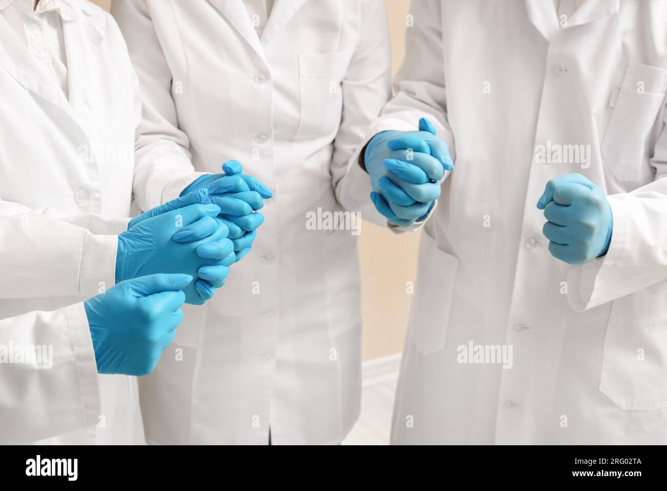 Many hands protective rubber gloves hi-res stock photography and images ...