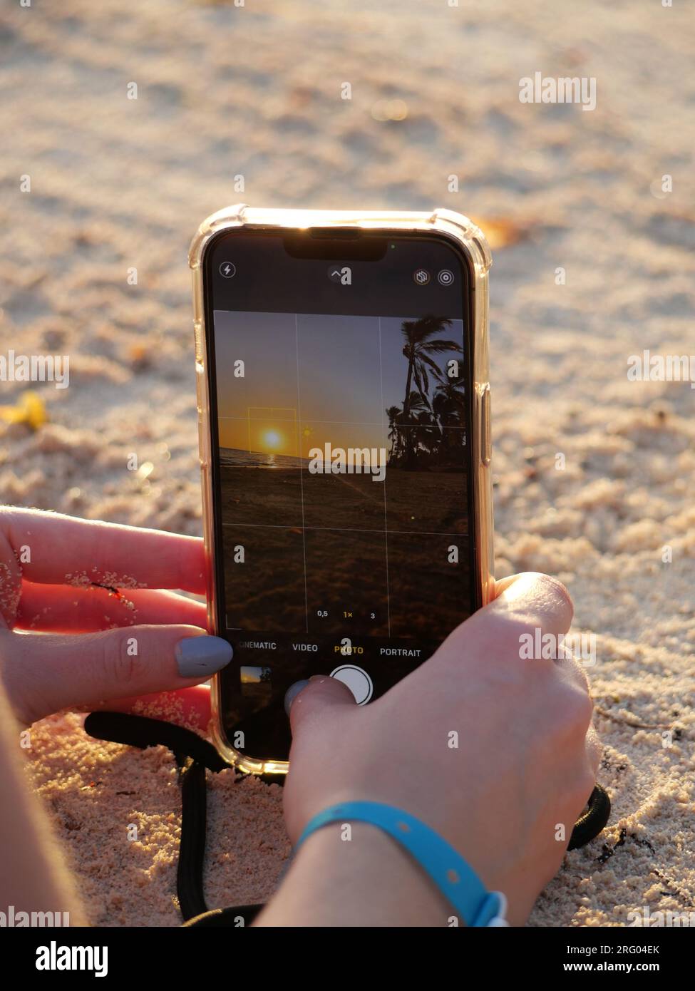 Sunset through a phone Stock Photo - Alamy