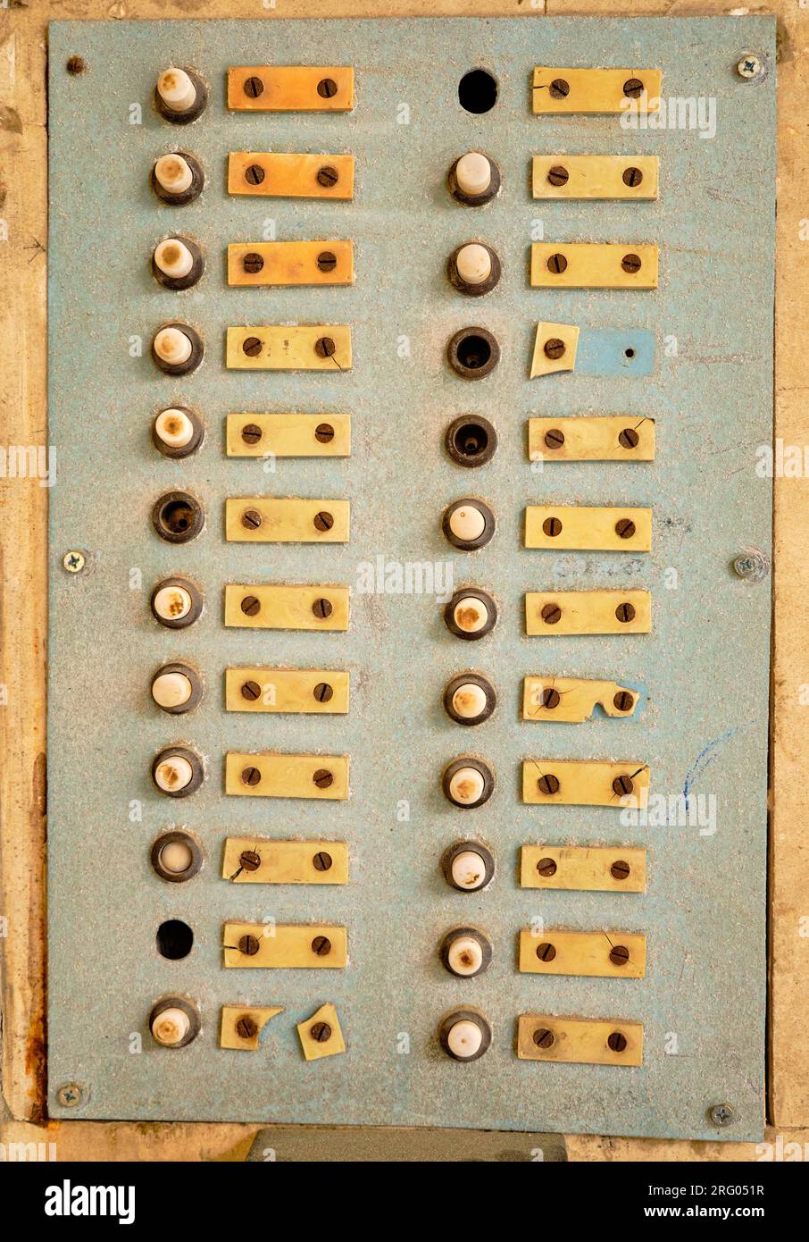 Vintage building call button panel, with broken buttons and nameless ...