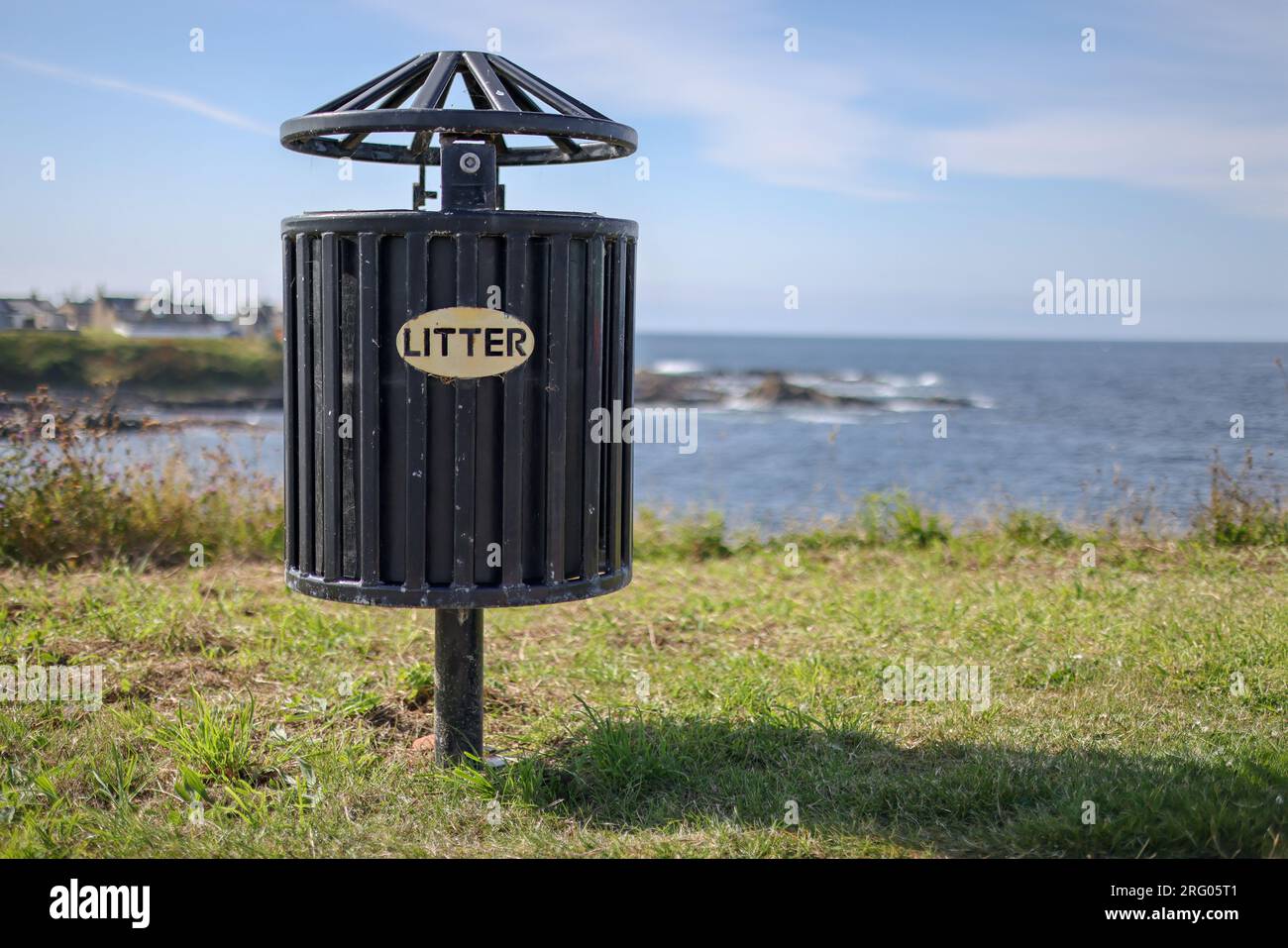 Litter bin / trash can by coastal view Stock Photo - Alamy