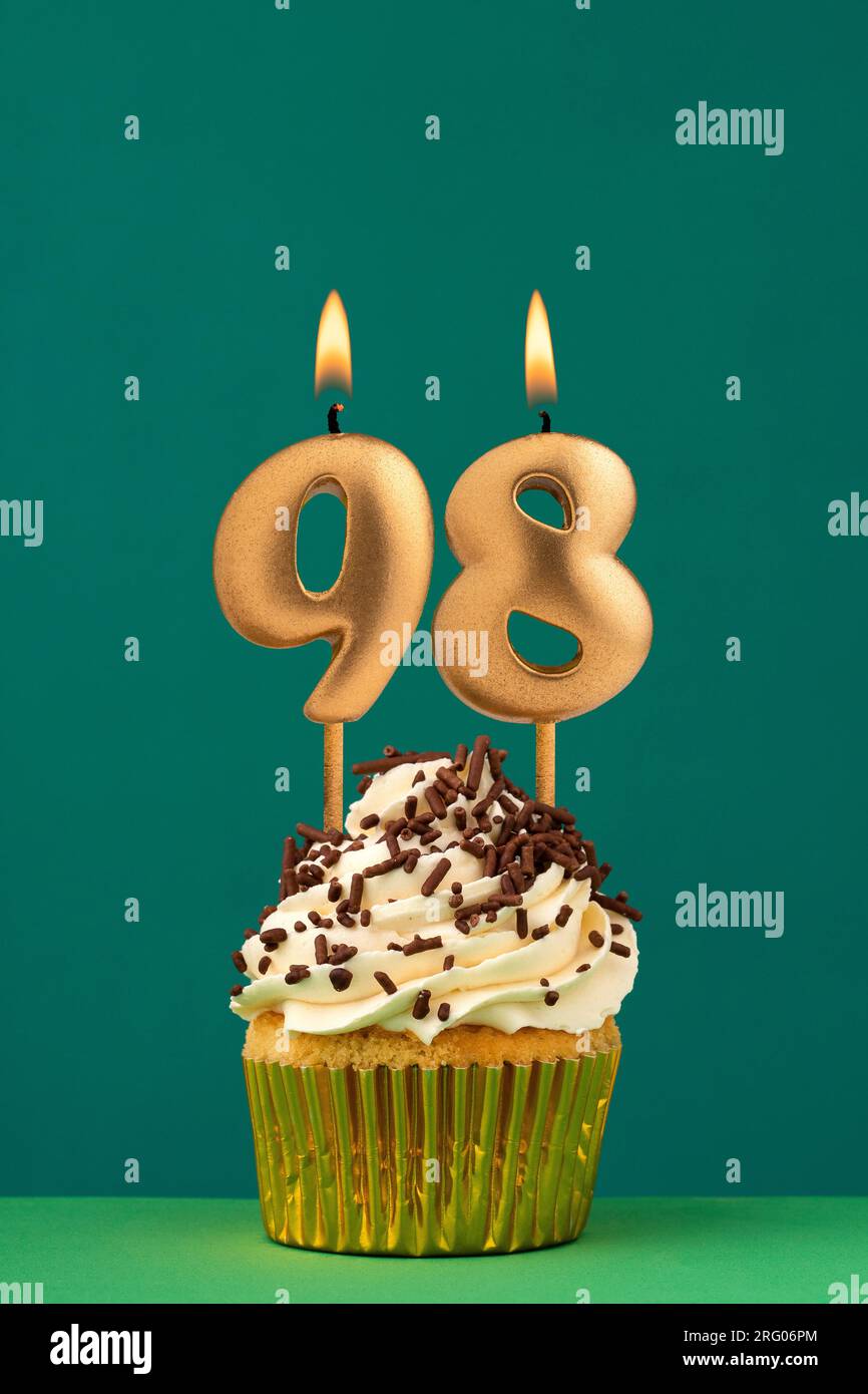 Birthday card with candle number 98 - Green background Stock Photo - Alamy