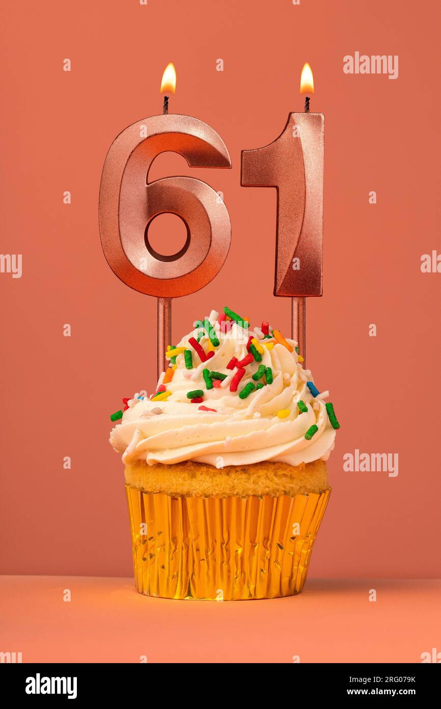 Birthday cake with candle number 61 - Coral fusion background Stock ...